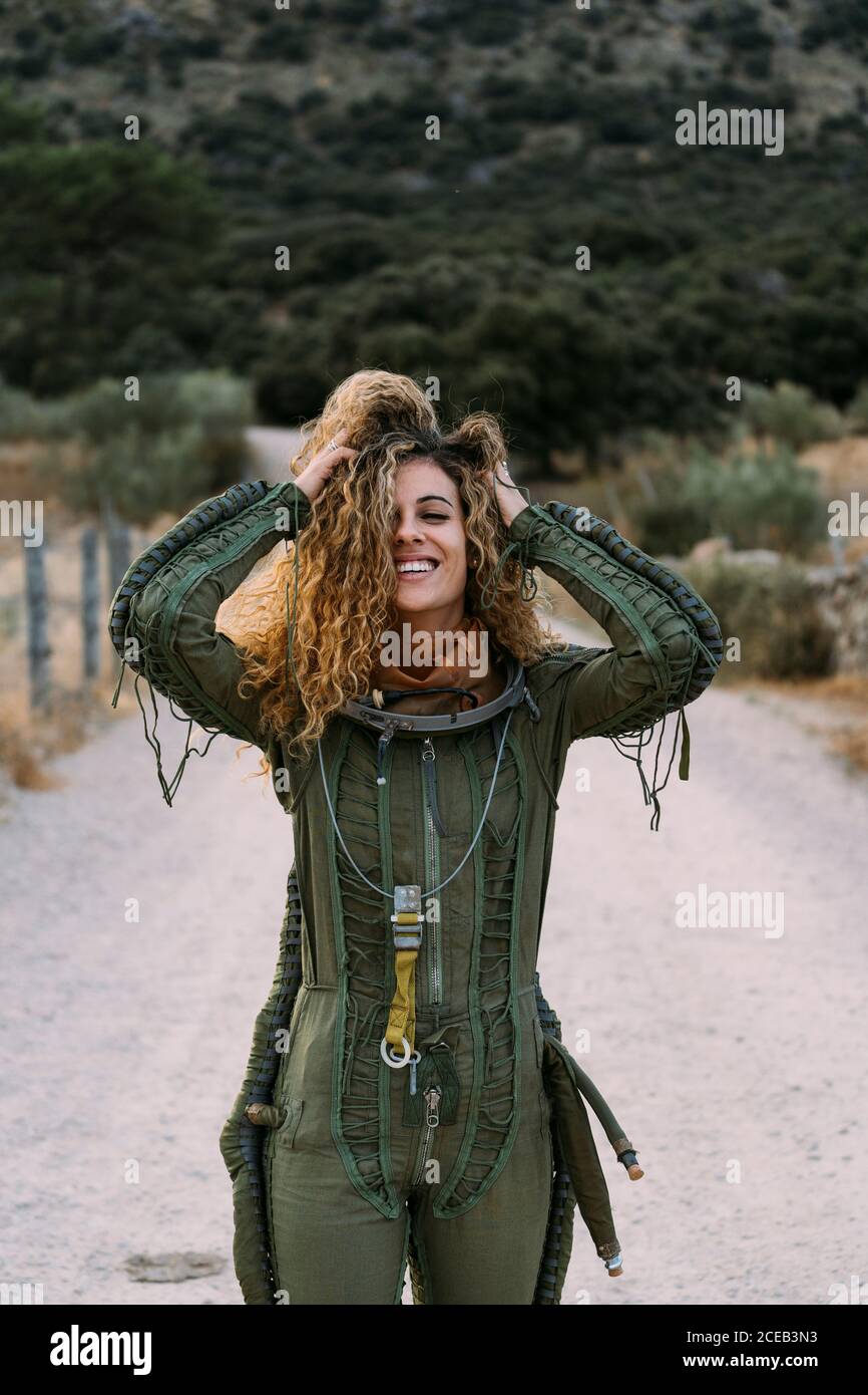Beautiful Woman posing dressed as an astronaut Stock Photo - Alamy