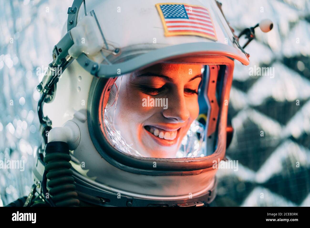 Beautiful Woman poses dressed as an astronaut Stock Photo - Alamy