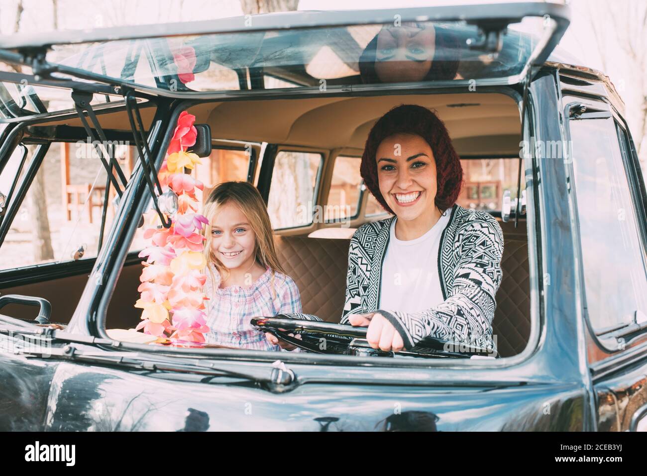 Young girls inside a van Stock Photo - Alamy