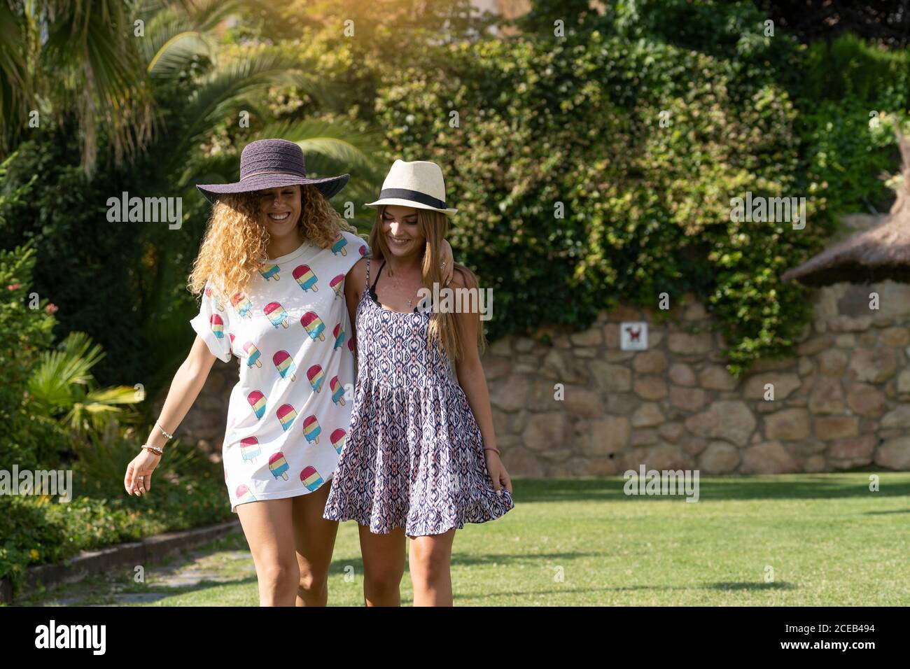 Beautiful young woman sunbathing poolside hi-res stock photography and ...