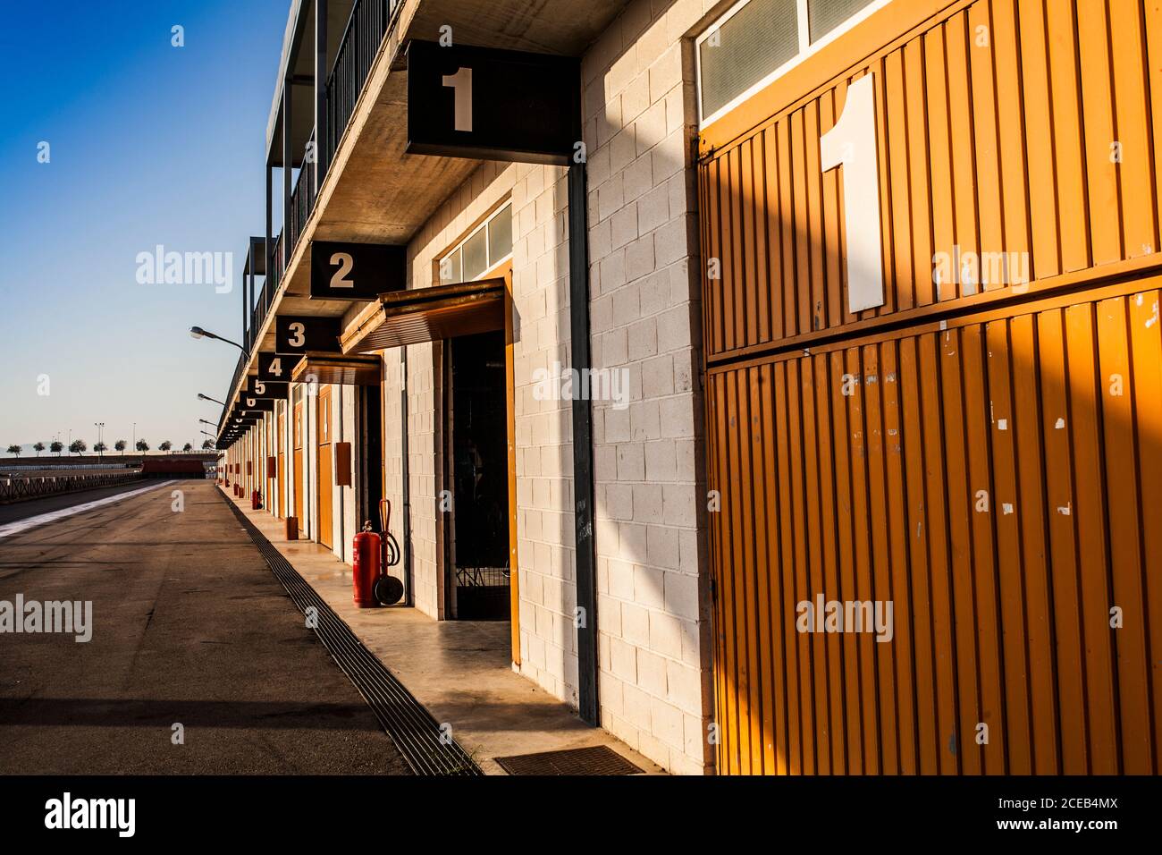 Street with orange garages with numbers Stock Photo - Alamy