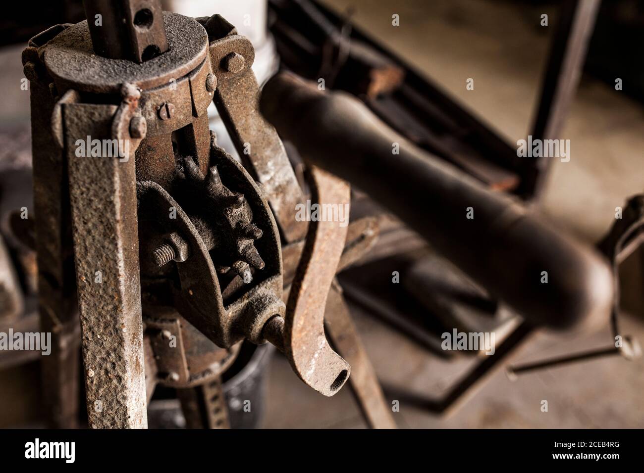 Crop close-up view of power hammer shaping metal in metal casting ...