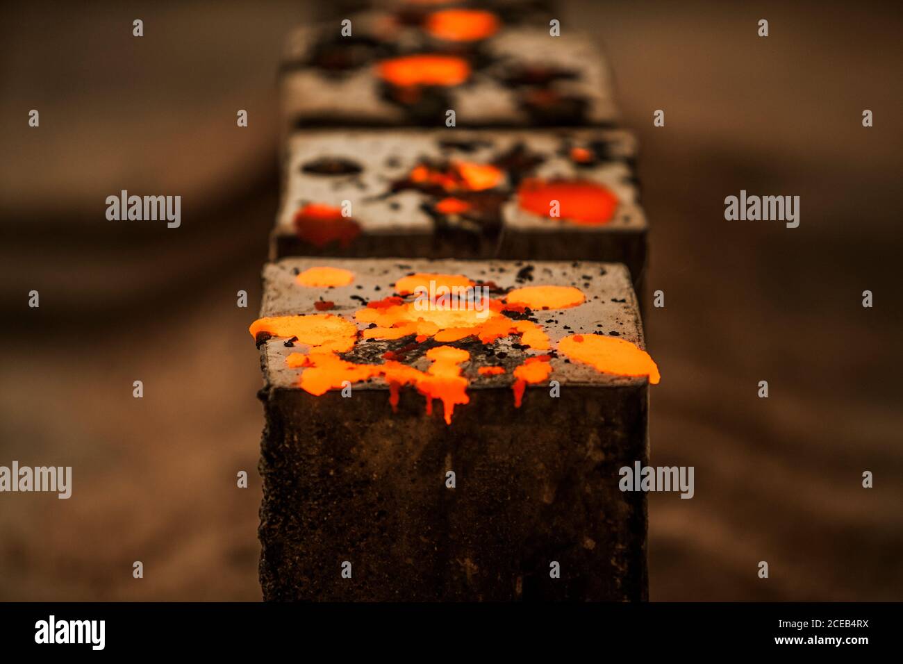 Crop close-up view of drops warm iron in metal casting factory Stock ...