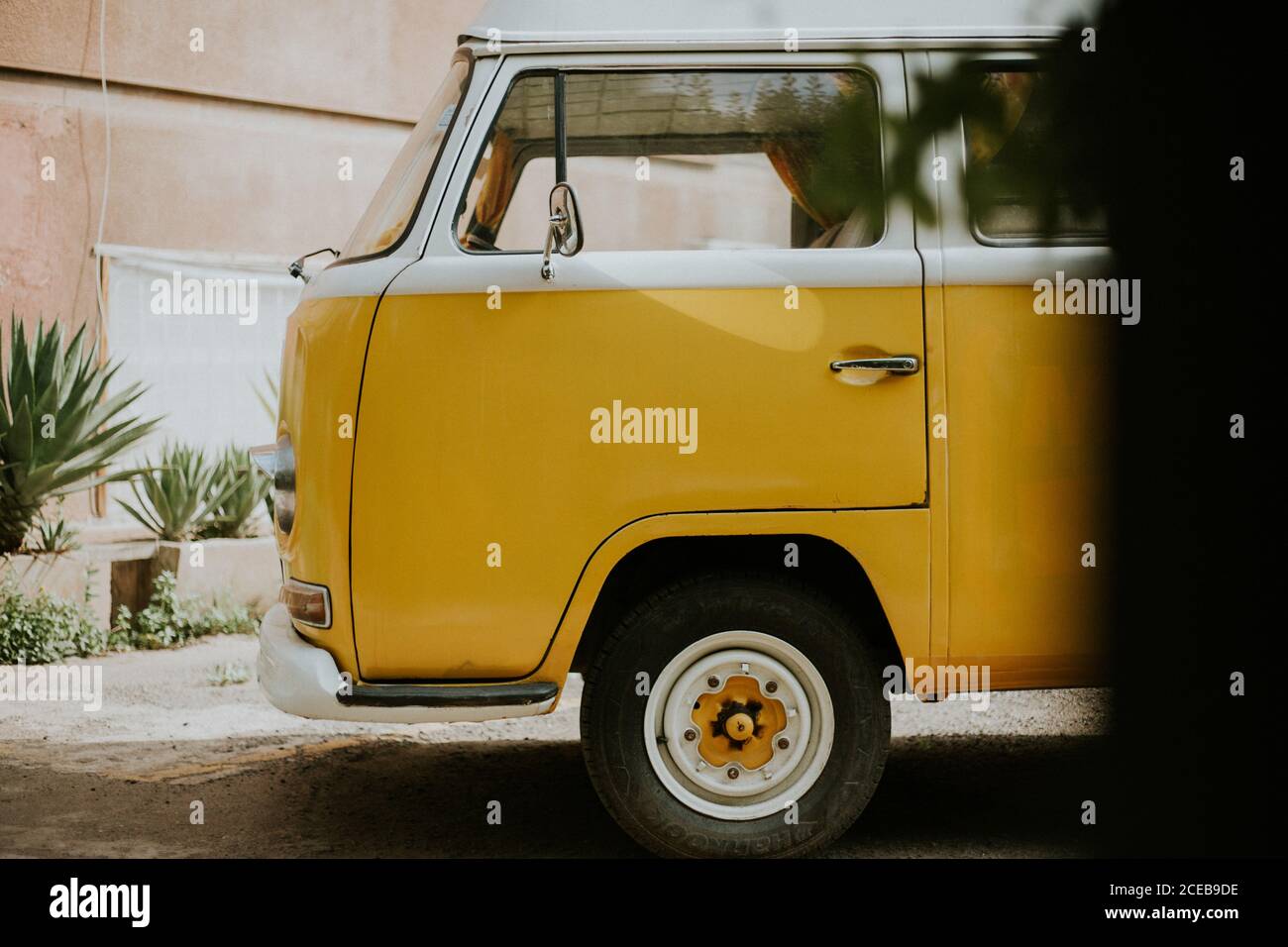 Yellow colored bright van parked on sunny street in Morocco Stock Photo ...