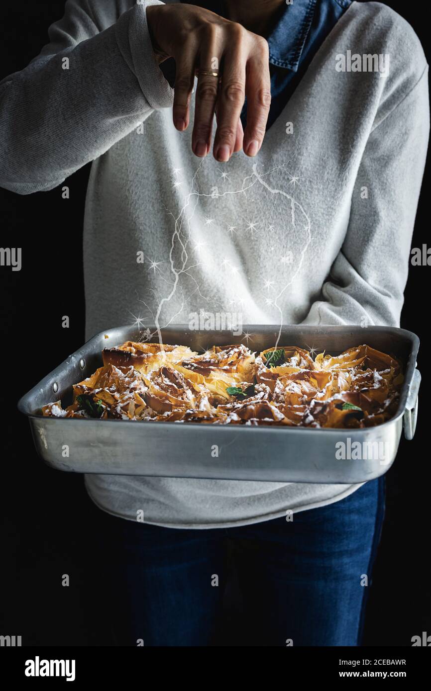 Filo dough with flower shape with hands of unrecognizable Woman doing ...