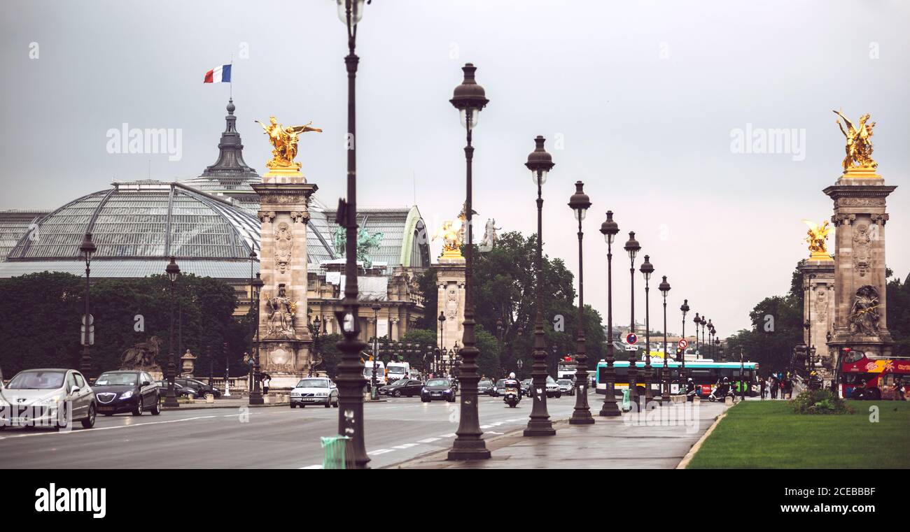 Alexander III bridge in Paris with lanterns standing along and gold ...