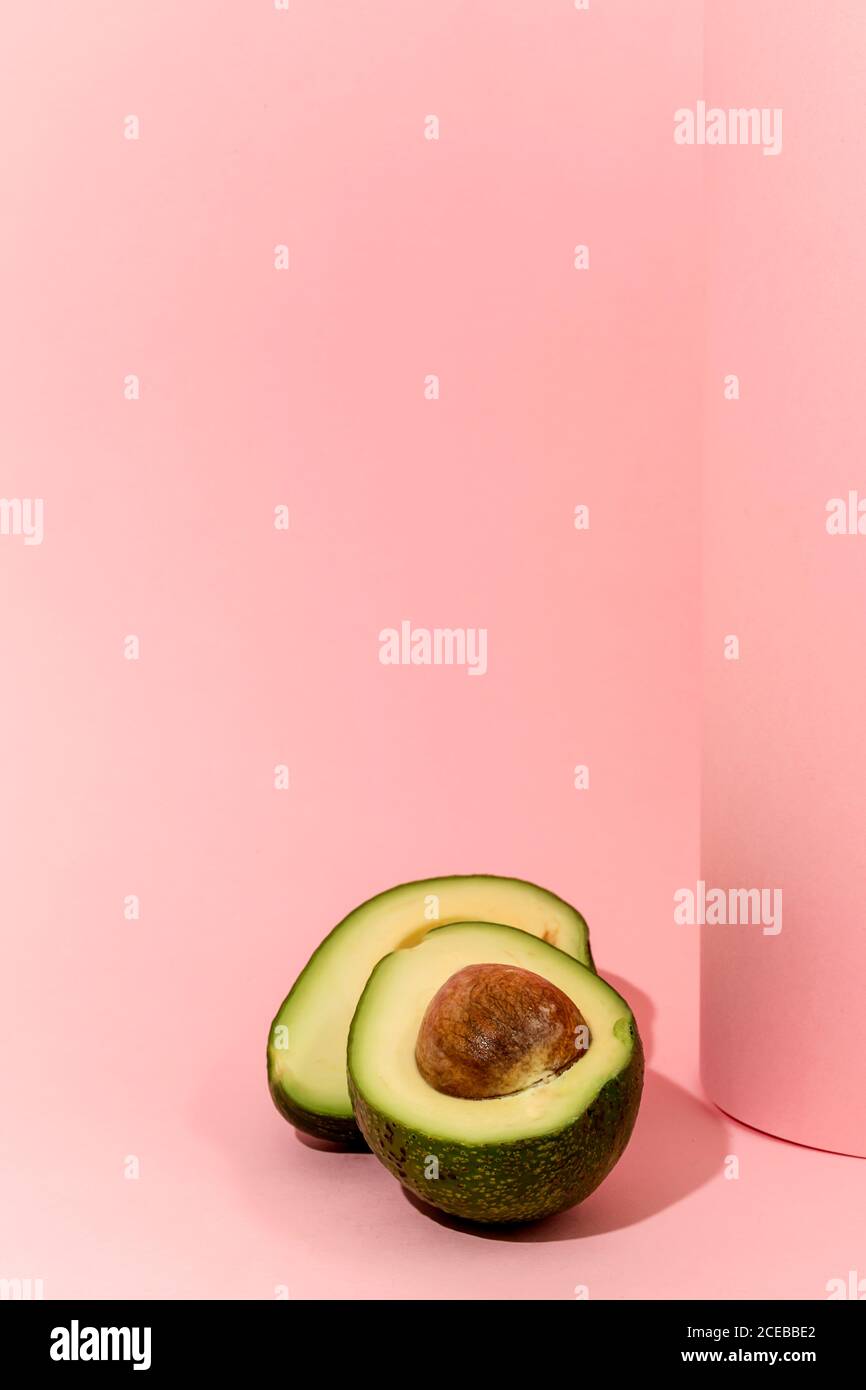 Fresh avocados on pink background. Isolated Stock Photo - Alamy Fresh avocados on pink background. Isolated Stock Photo - Alamy