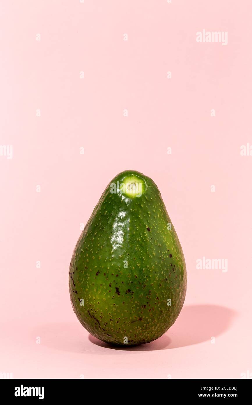 Fresh avocados on pink background. Isolated Stock Photo - Alamy