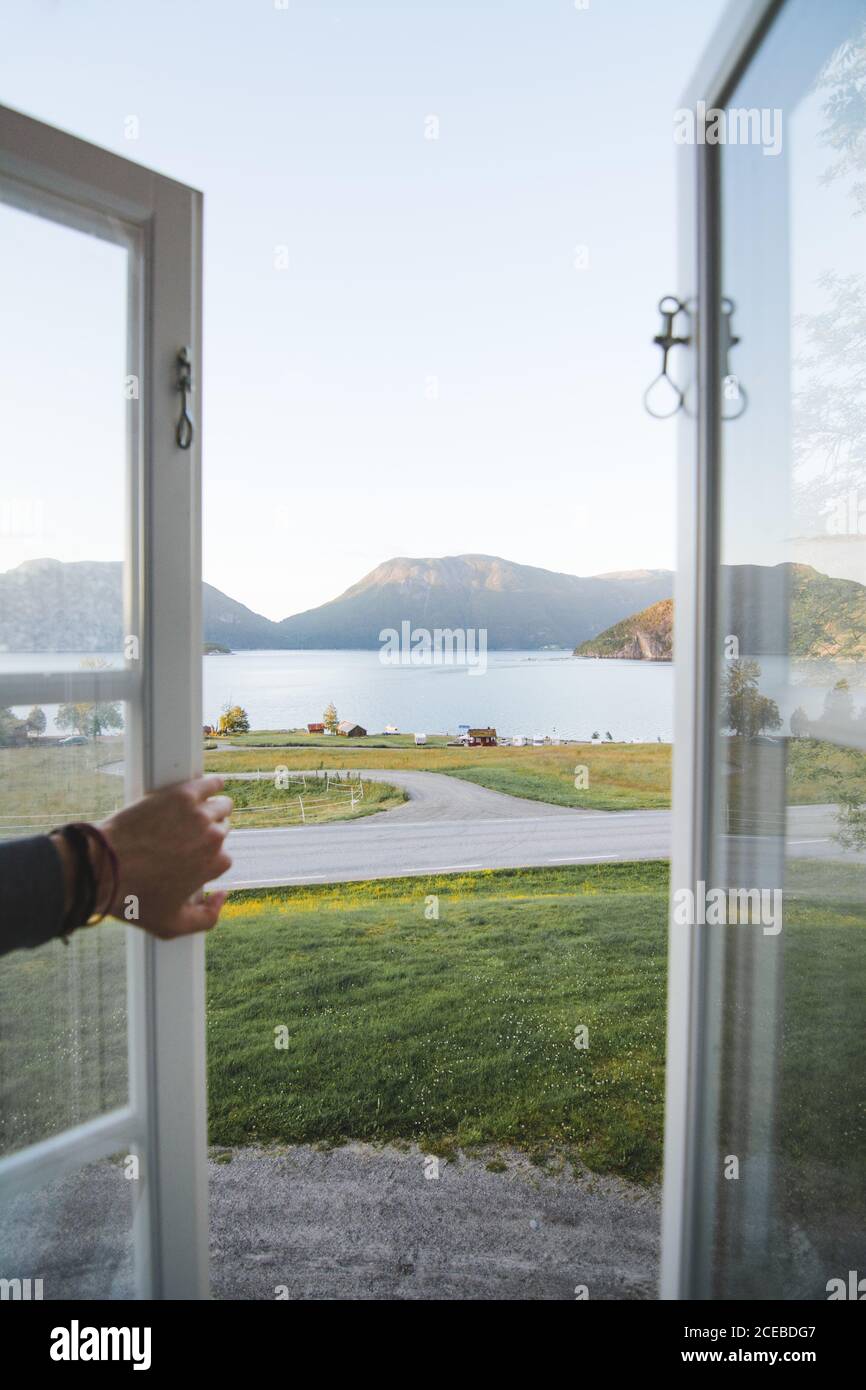 Beautiful lake and mountain landscape view lying through open window ...