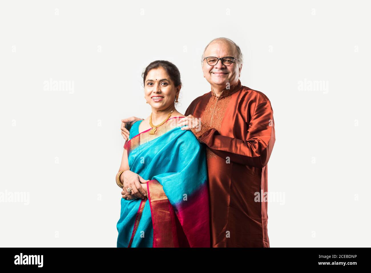 Portrait of Happy Indian asian senior or retired couple in traditional ...