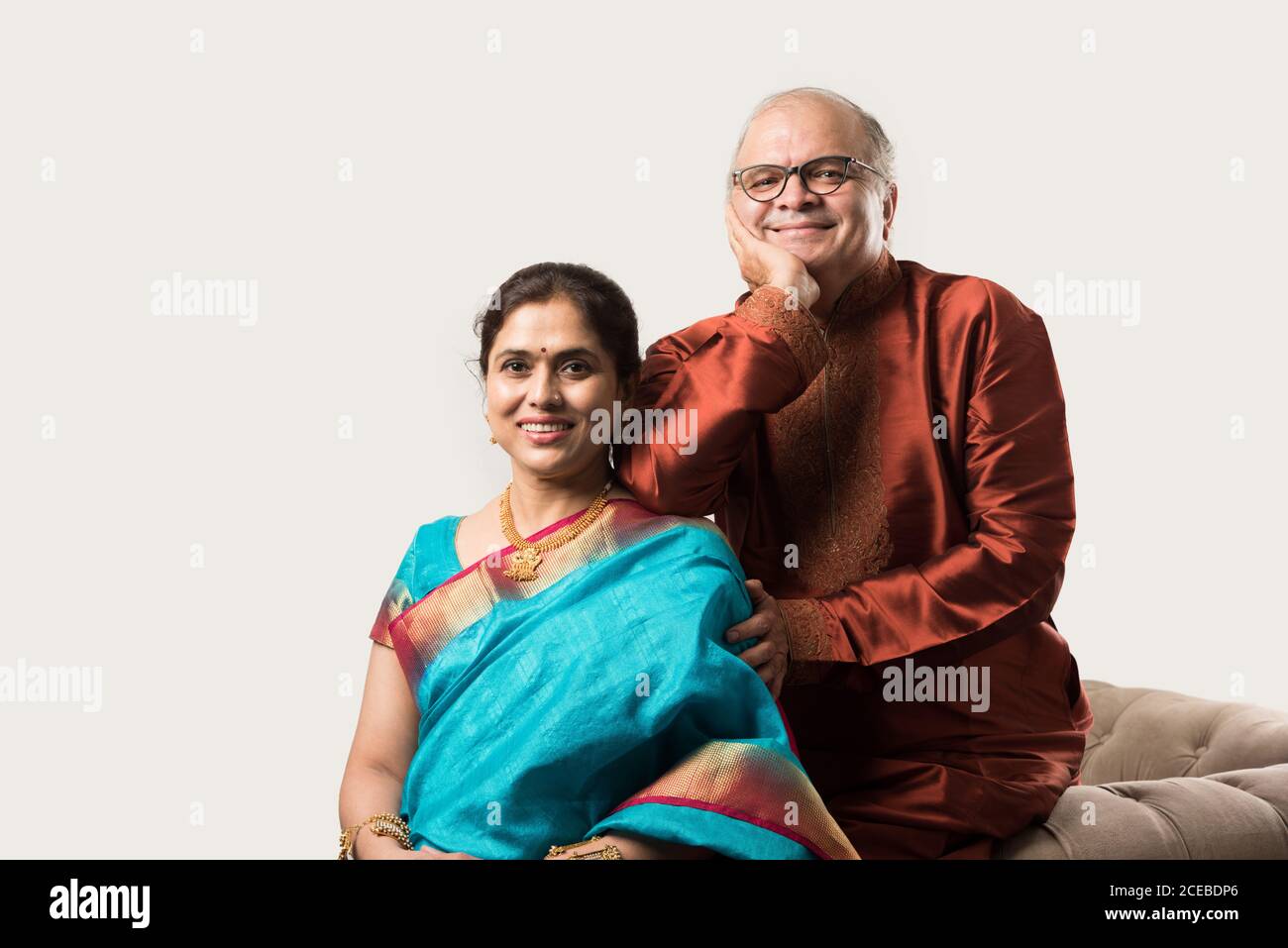 Portrait of Happy Indian asian senior or retired couple in traditional ...
