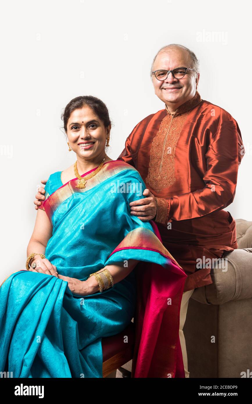 Portrait of Happy Indian asian senior or retired couple in traditional ...