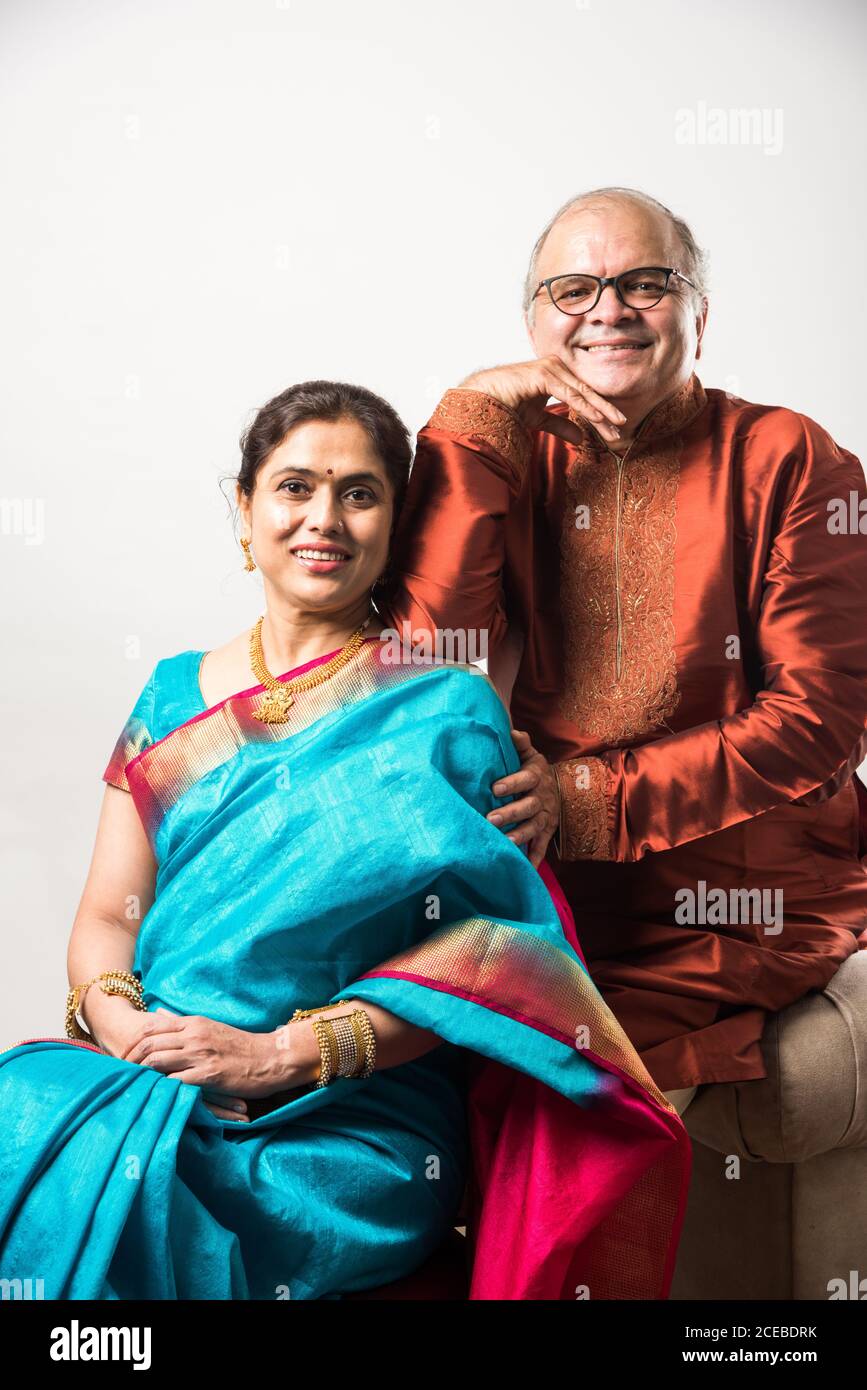 Portrait of Happy Indian asian senior or retired couple in traditional ...