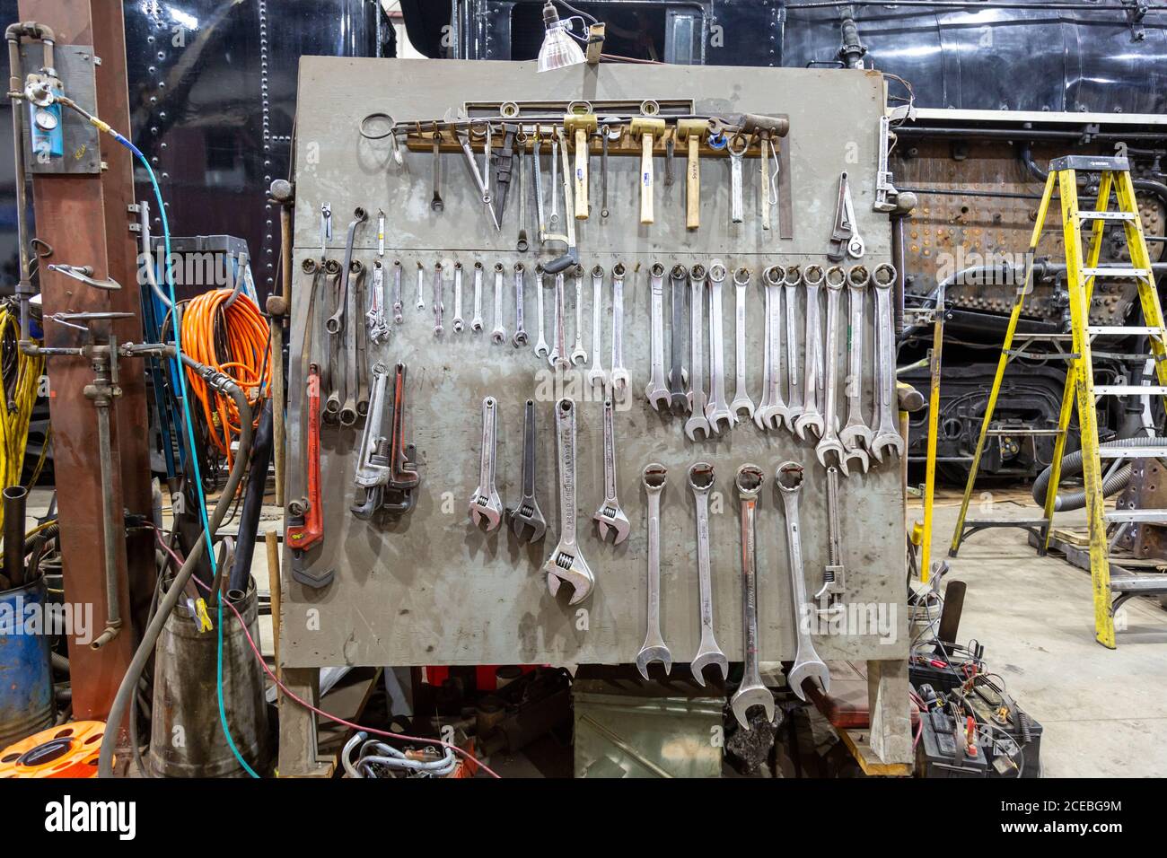 A rack of assorted wrenches are available for the workshop Stock Photo ...