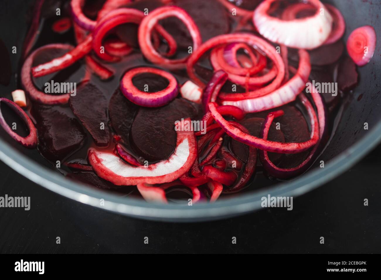 simple food ingredients concept, red onion rings and slices of beetroot ...