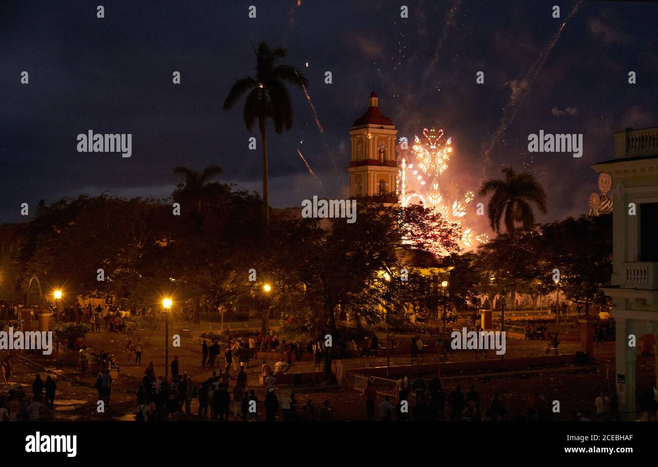 From above people celebrating holiday on square with high tower in ...