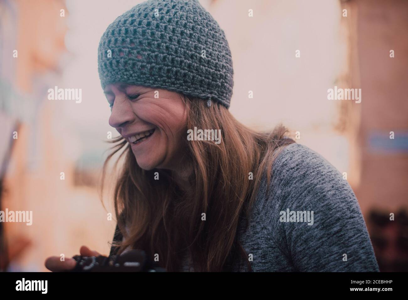 Laughing Woman with camera Stock Photo - Alamy