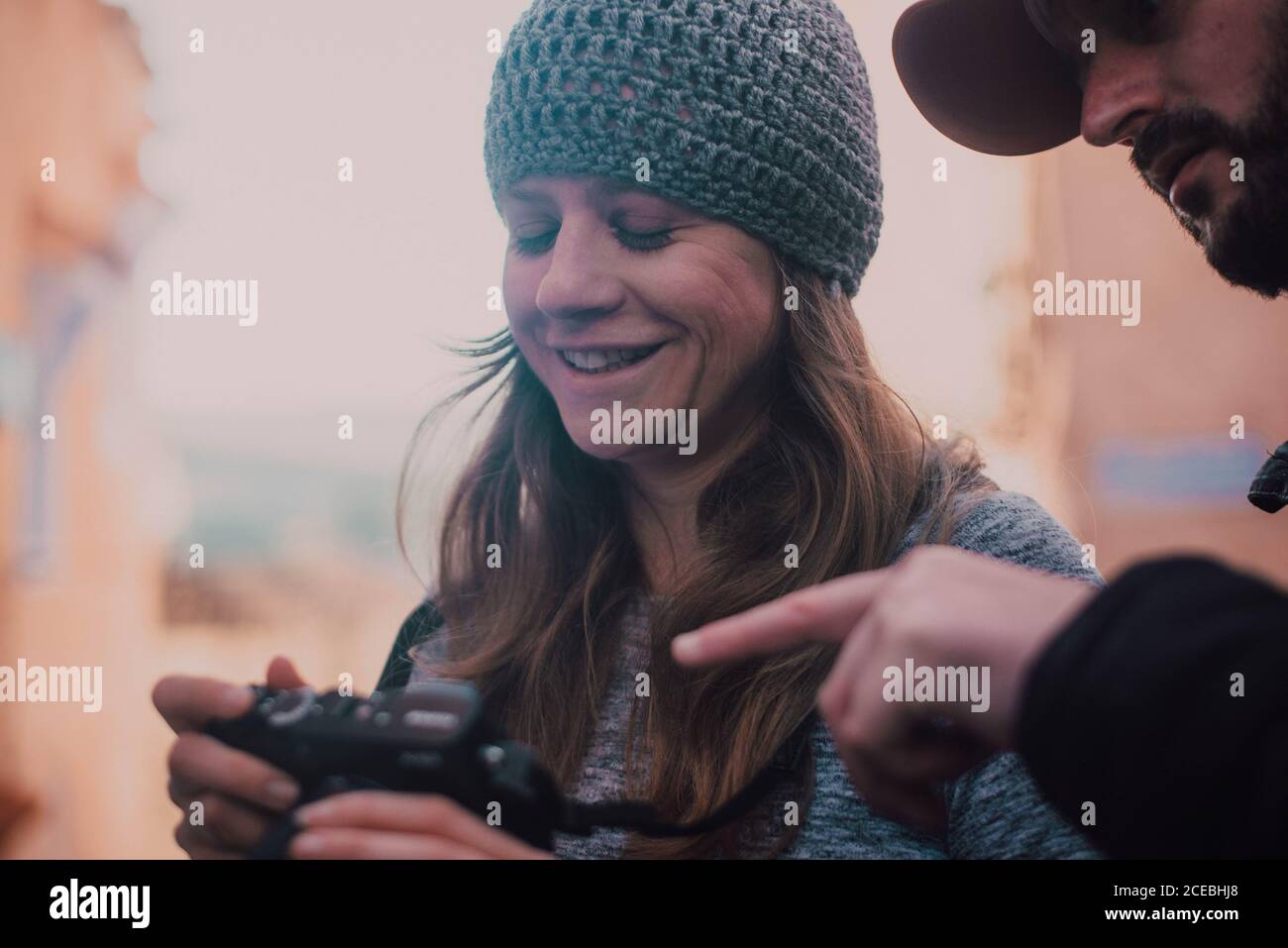 Laughing Woman with camera Stock Photo - Alamy