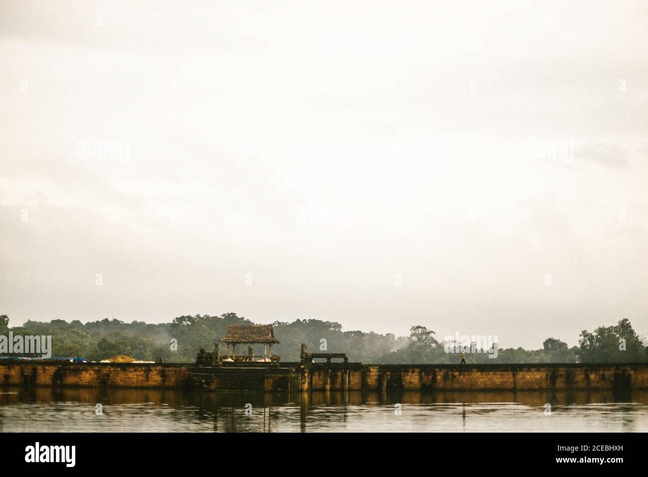 Side view people walking bridge between water hi-res stock photography ...