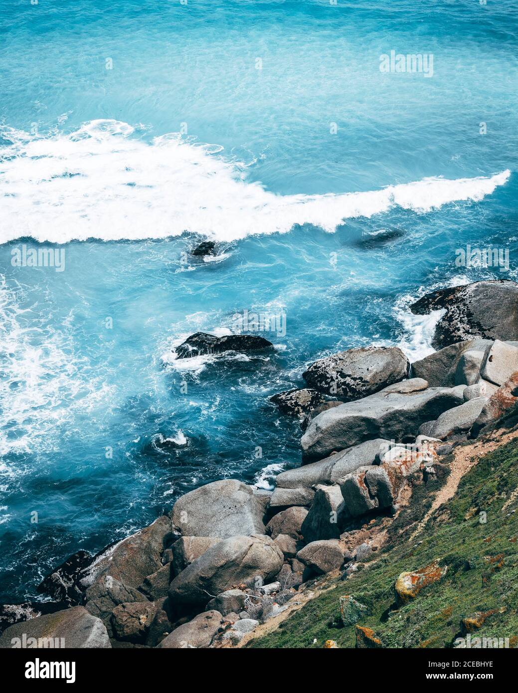 From above sandy coast with rocks and blue ocean in sunny day Stock ...