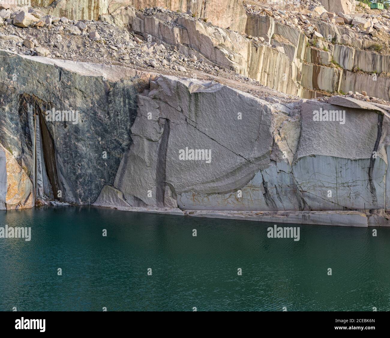 Calm water near stone quarry Stock Photo - Alamy
