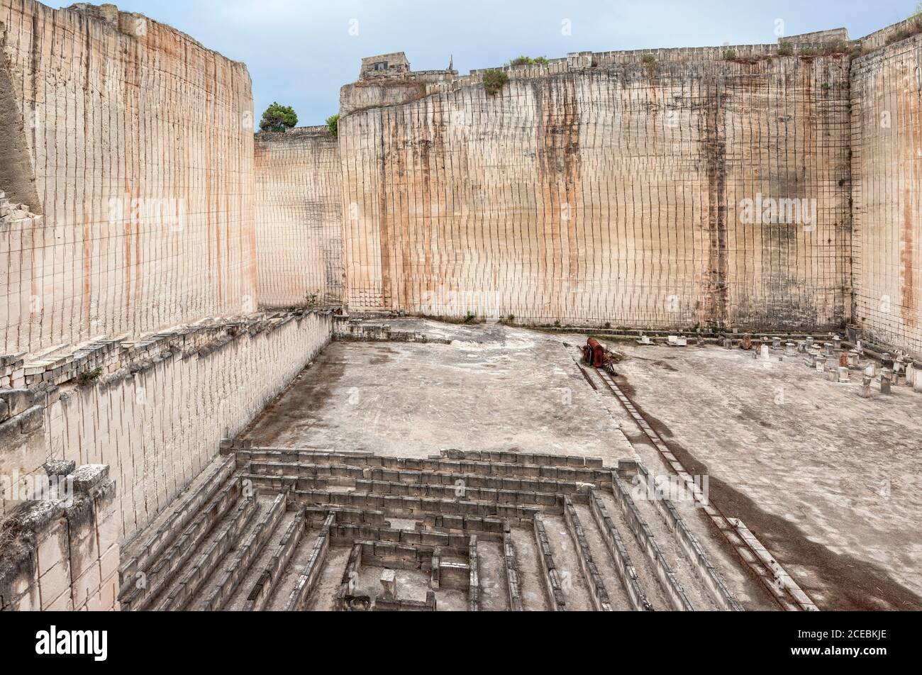 Amazing aerial view of walls and pit of rock quarry on sunny day on ...