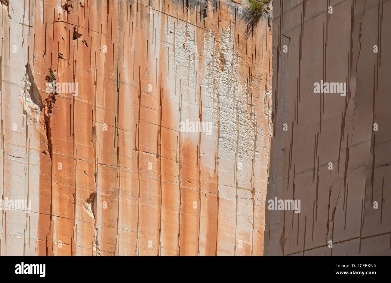 Rough wall of stone quarry Stock Photo - Alamy