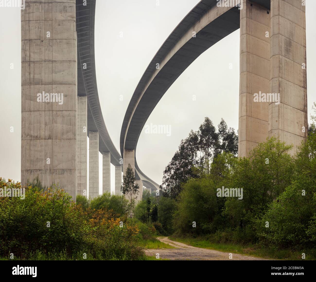Beautiful white viaduct with trees below Stock Photo - Alamy
