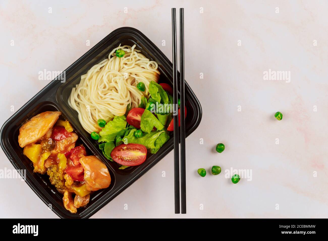 Chinese food in plastic container with chopstick. Food delivery concept ...