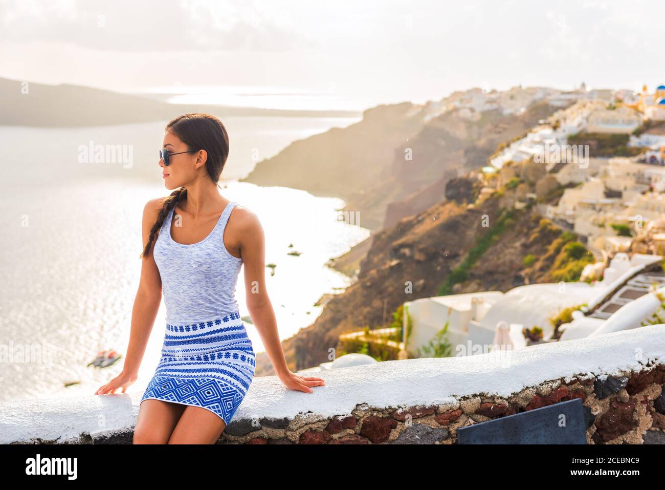Fashion model posing in Santorini island, Oia city, Greece, Europe ...