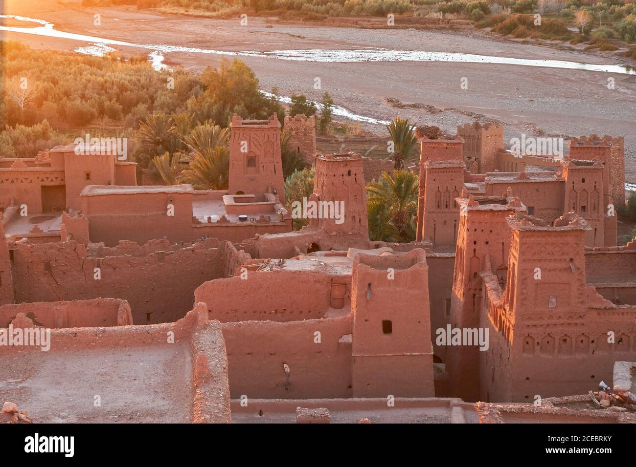 From above old town with stone constructions near narrow river between ...