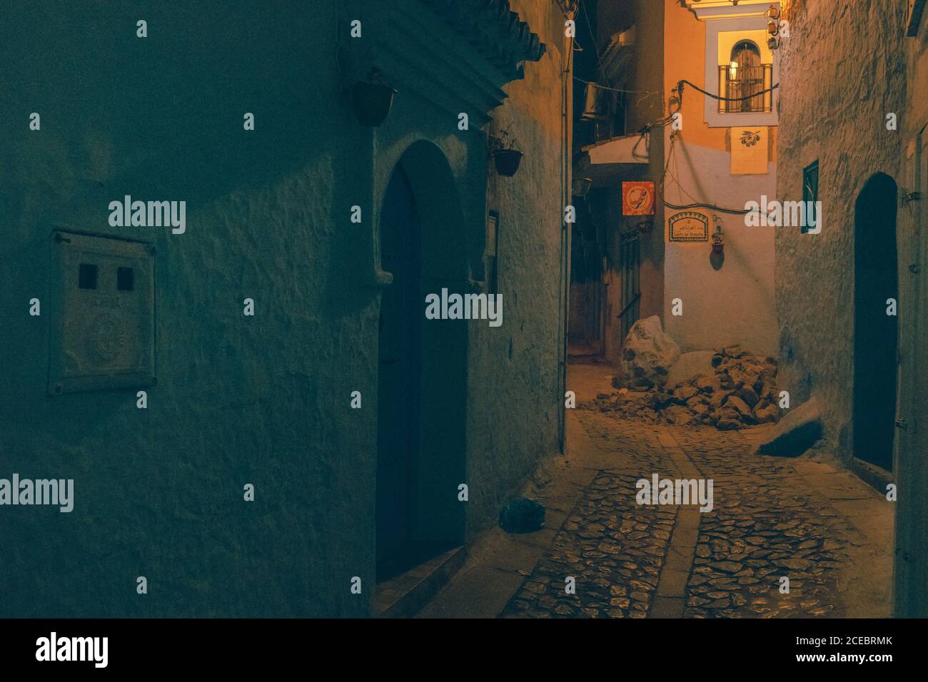 Amazing view of poor street between ancient houses in evening in ...