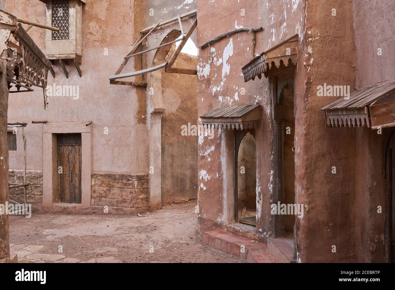 Amazing view of poor street between ancient houses in Marrakesh ...