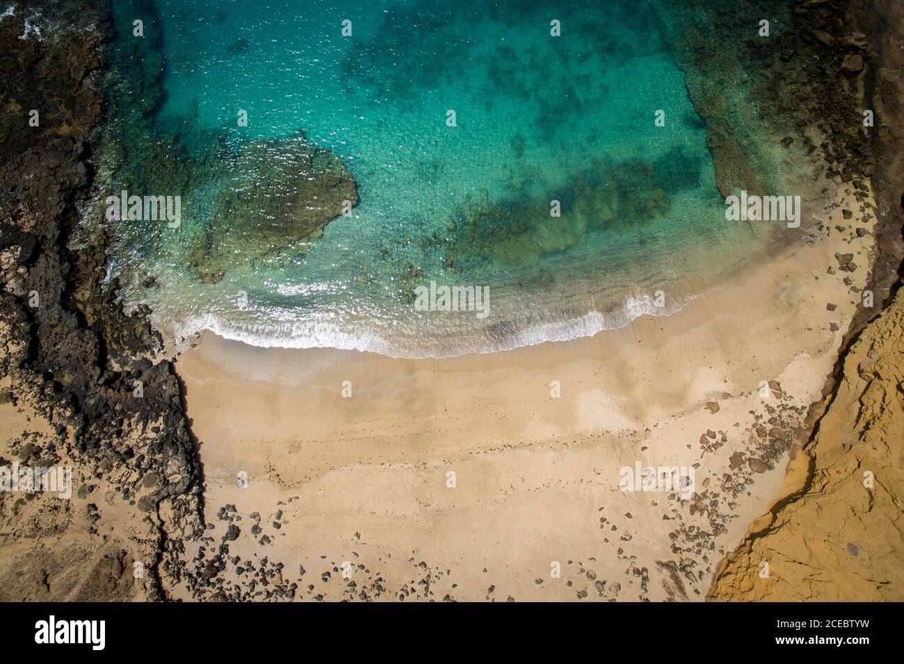 Ocean lagoon and sandy beach with rocks Stock Photo - Alamy