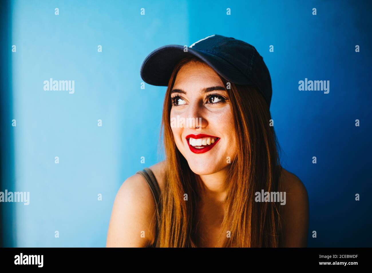 Smiling attractive lady in cap Stock Photo - Alamy