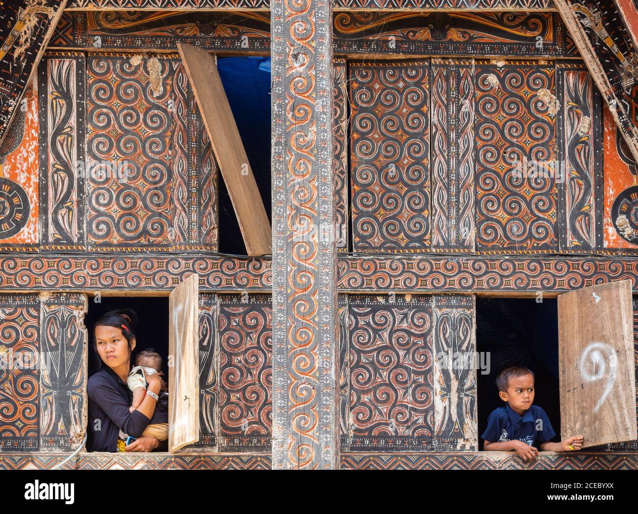 Bali, Indonesia - August, 15 2015: Ethnic woman with infant and funny ...