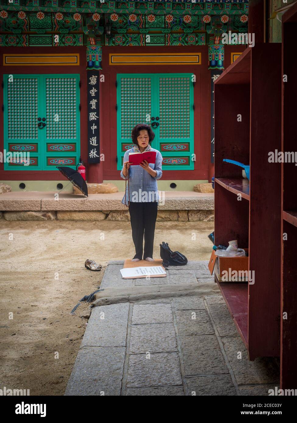 Busan, South Korea - August, 05 2017: Adult Asian lady reading ...