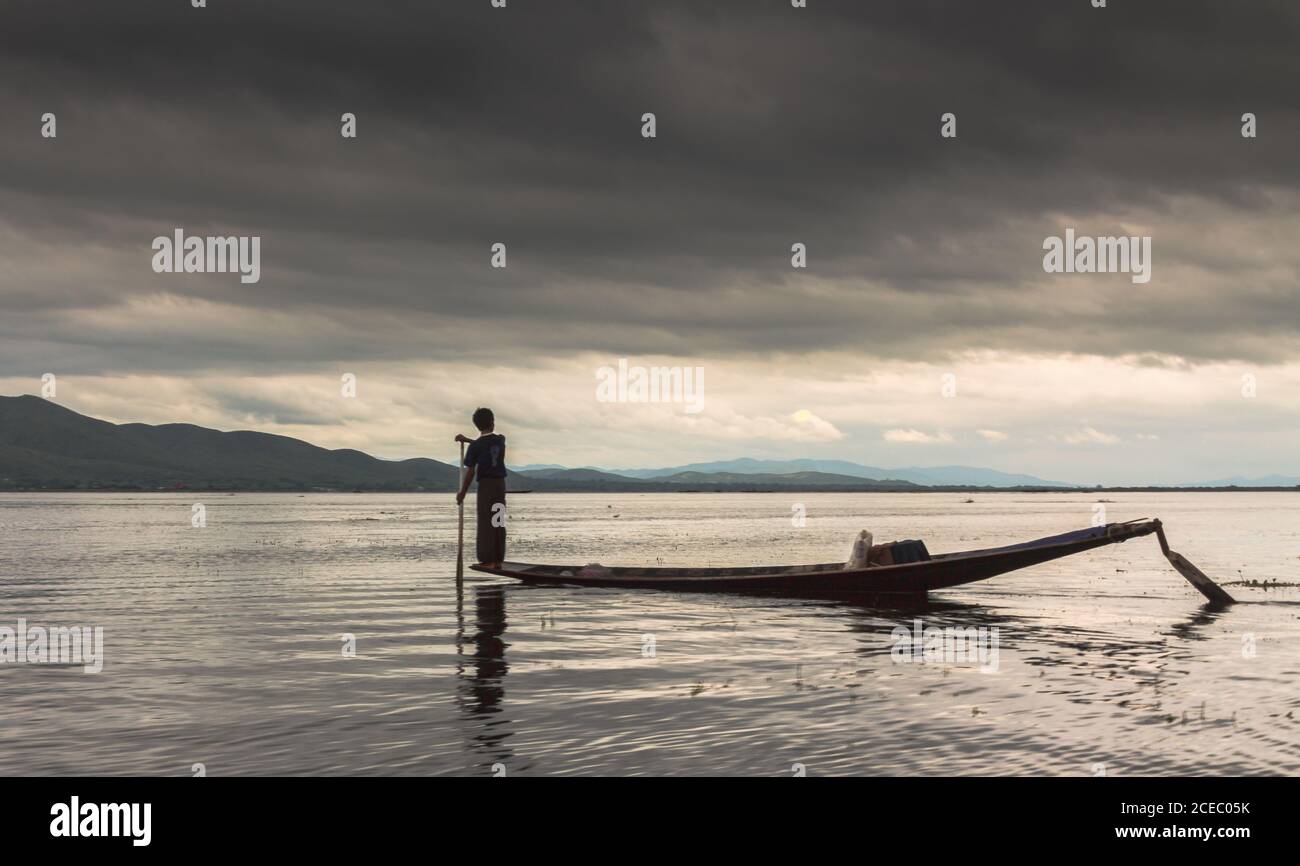 Anonymous fisherman standing boat hi-res stock photography and images ...