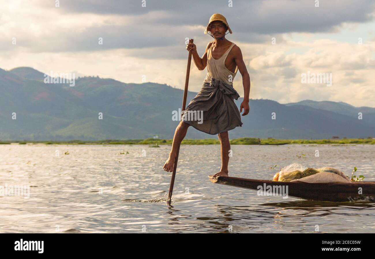 Anonymous fisherman standing boat hi-res stock photography and images ...