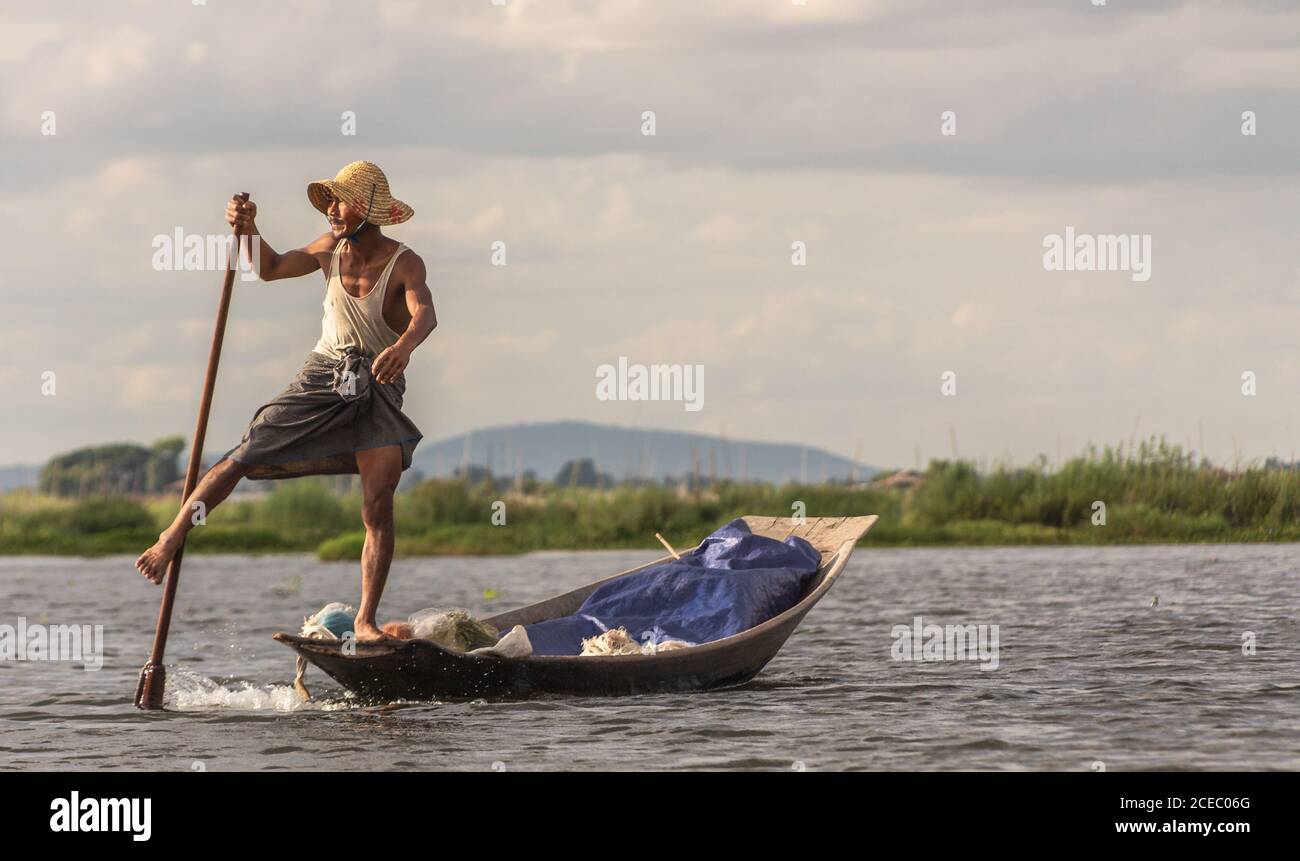 Anonymous fisherman standing boat hi-res stock photography and images ...