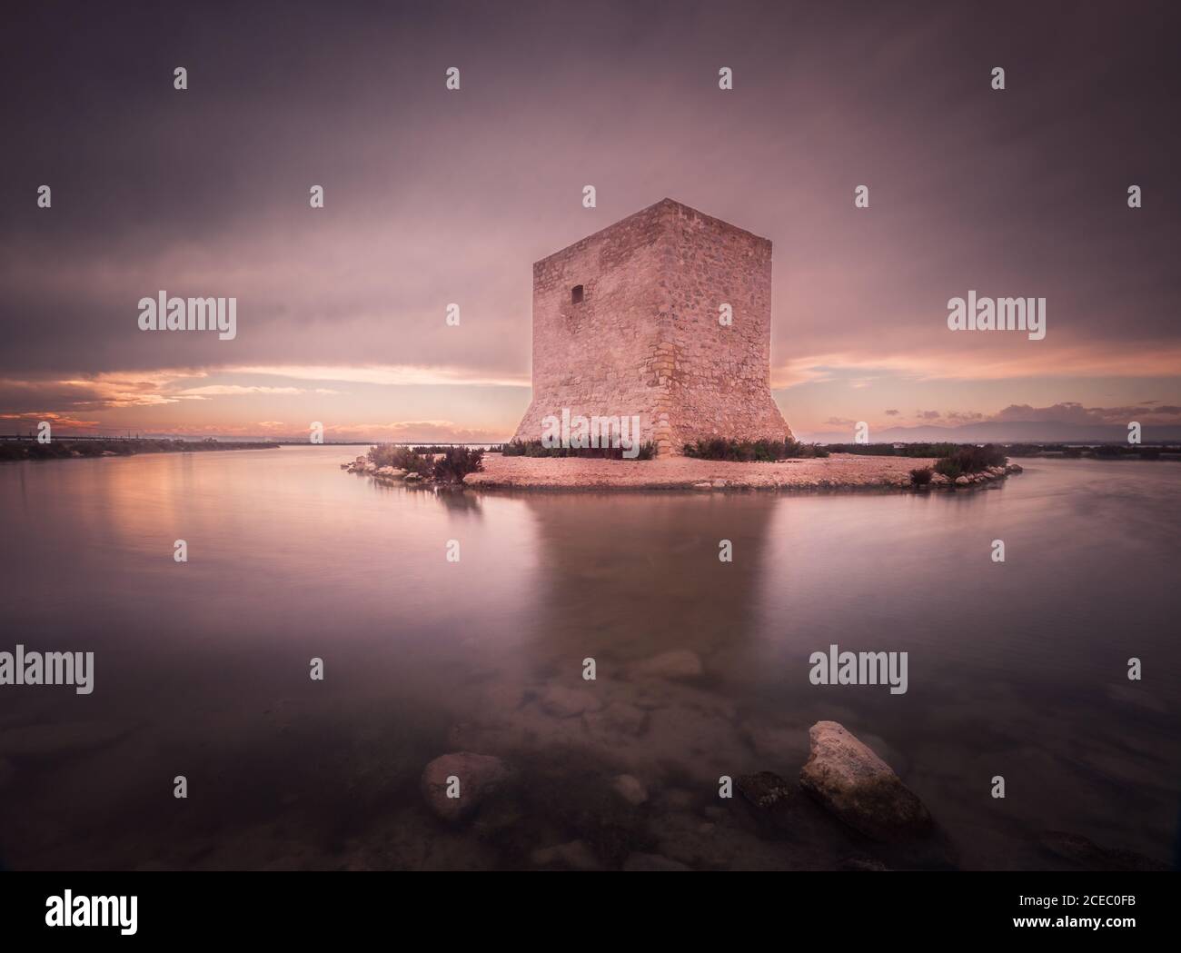 Wonderful watchtower in calm lake on cloudy day Stock Photo - Alamy