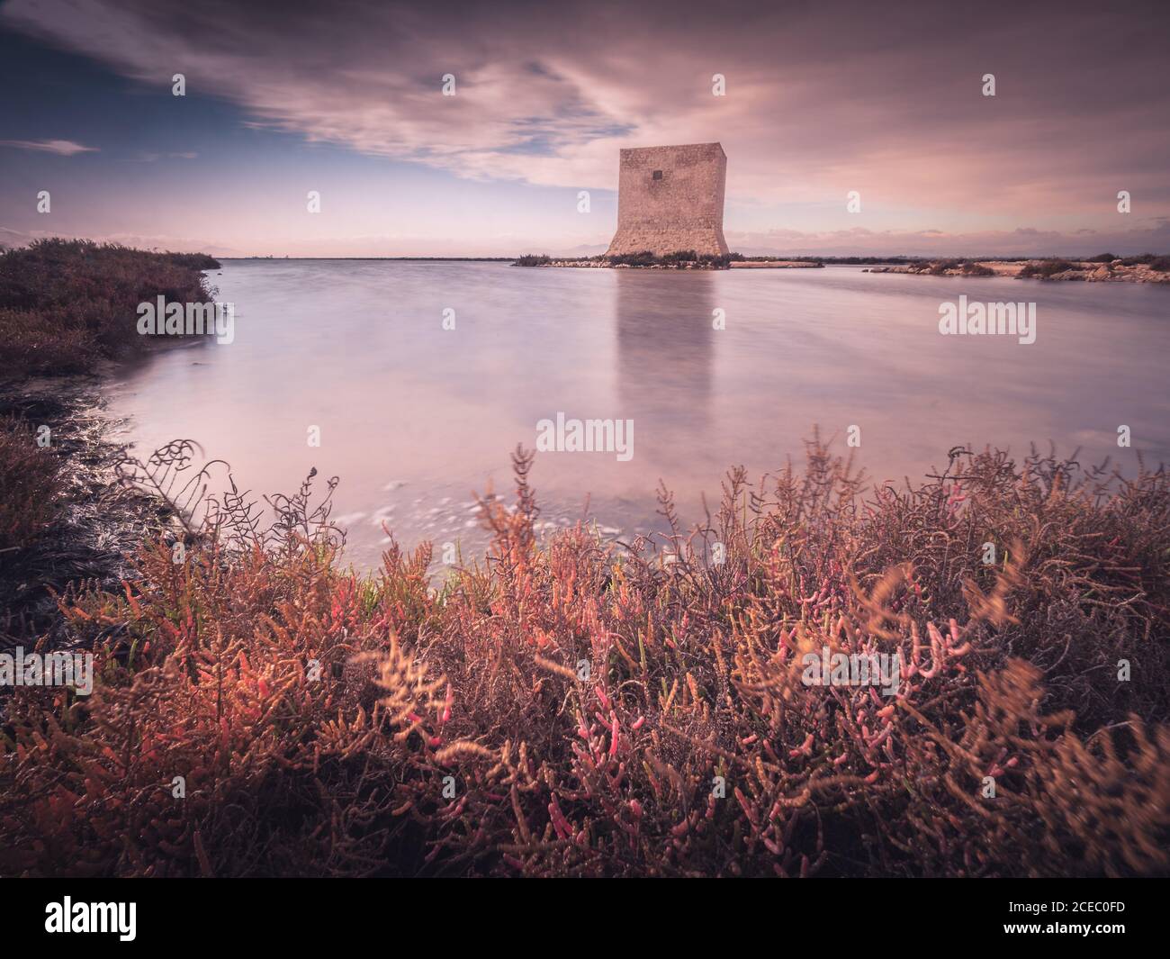 Wonderful watchtower in calm lake on cloudy day Stock Photo - Alamy