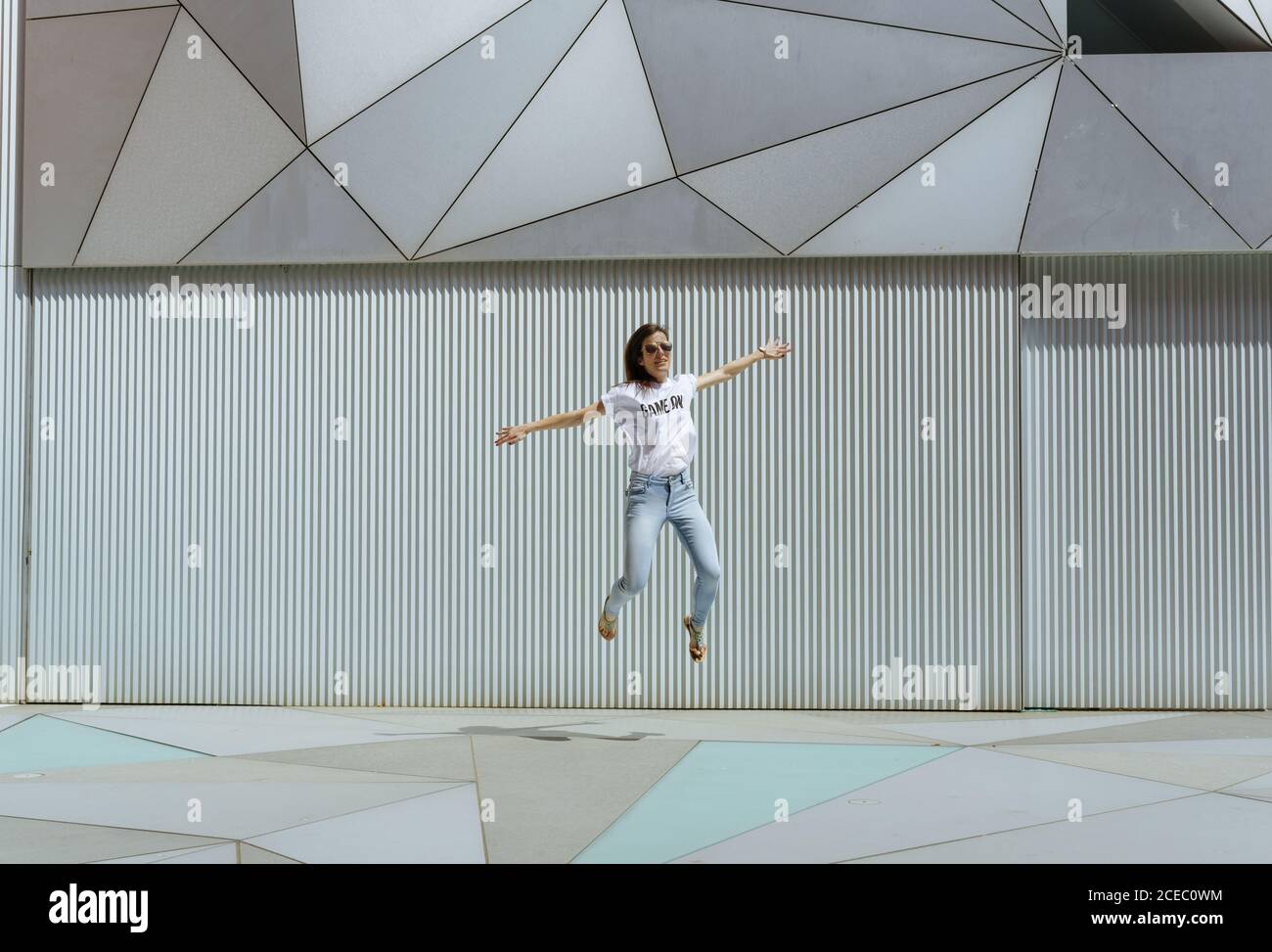 Lady jumping wall hi-res stock photography and images - Alamy
