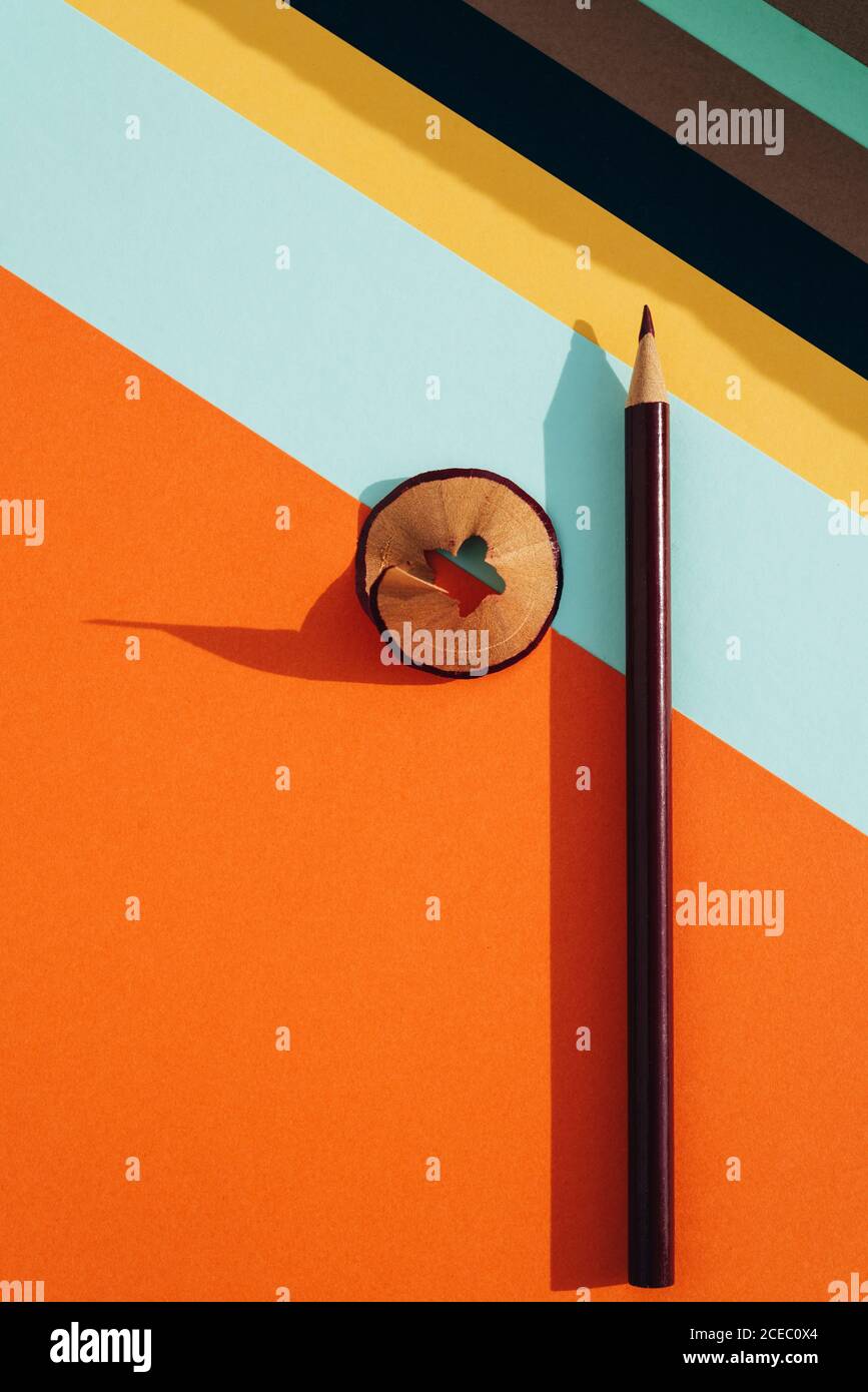 Pencil and shavings from sharpening, on colored striped papers ...