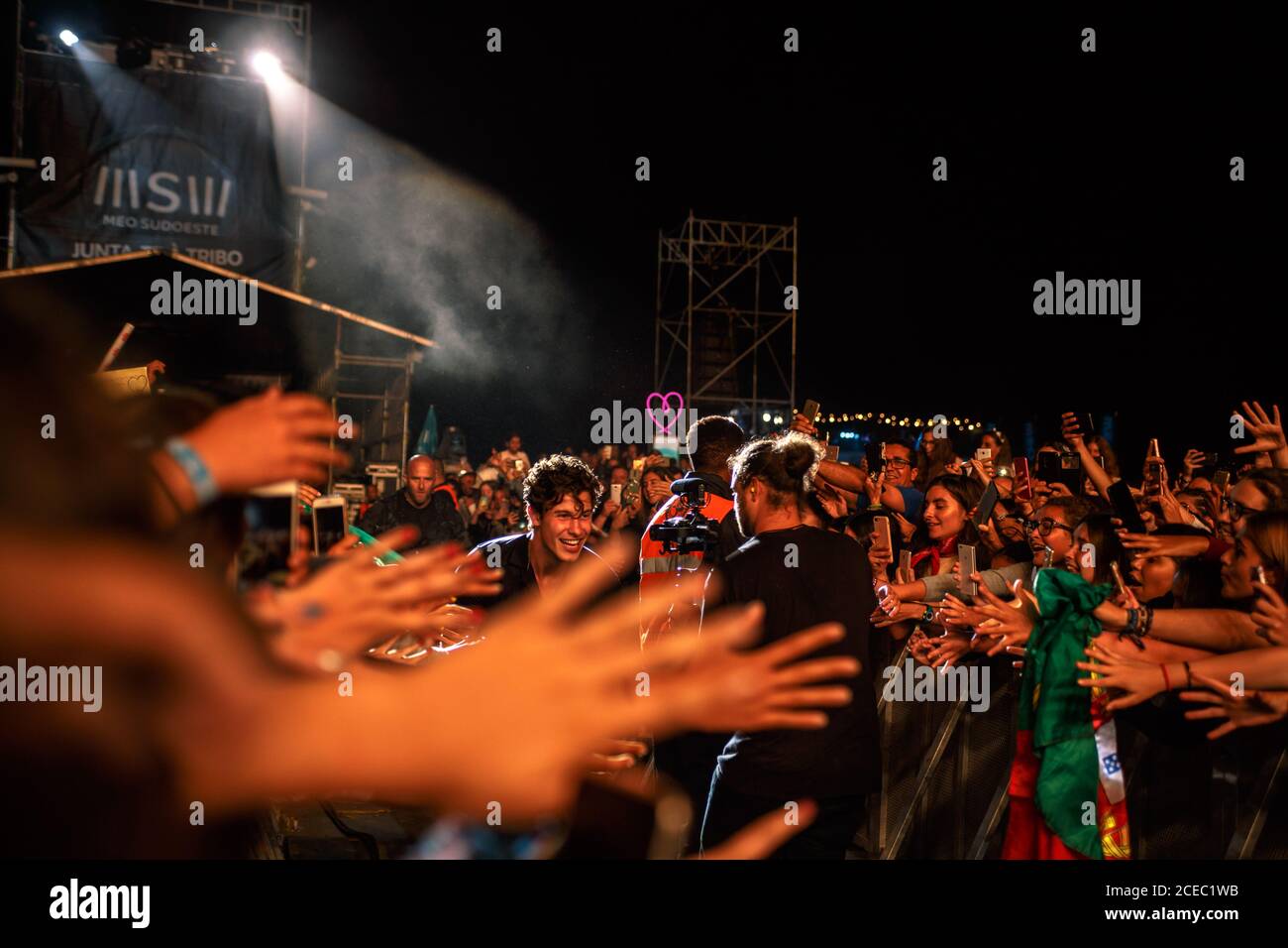 Famous singer walking among screaming fans on festival Stock Photo - Alamy