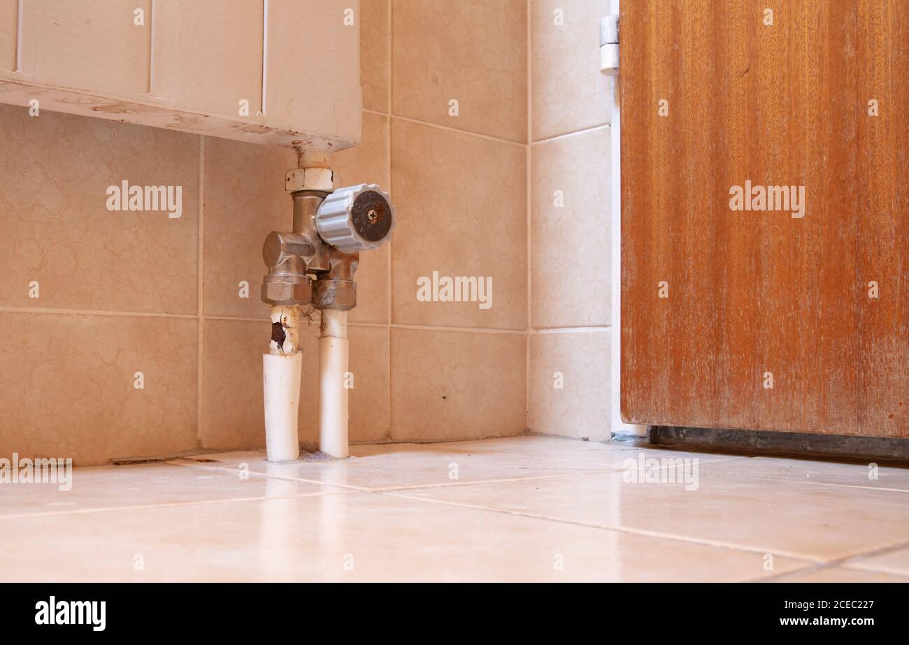 Heating radiator detail with adjusting knob, low to the ground Stock ...