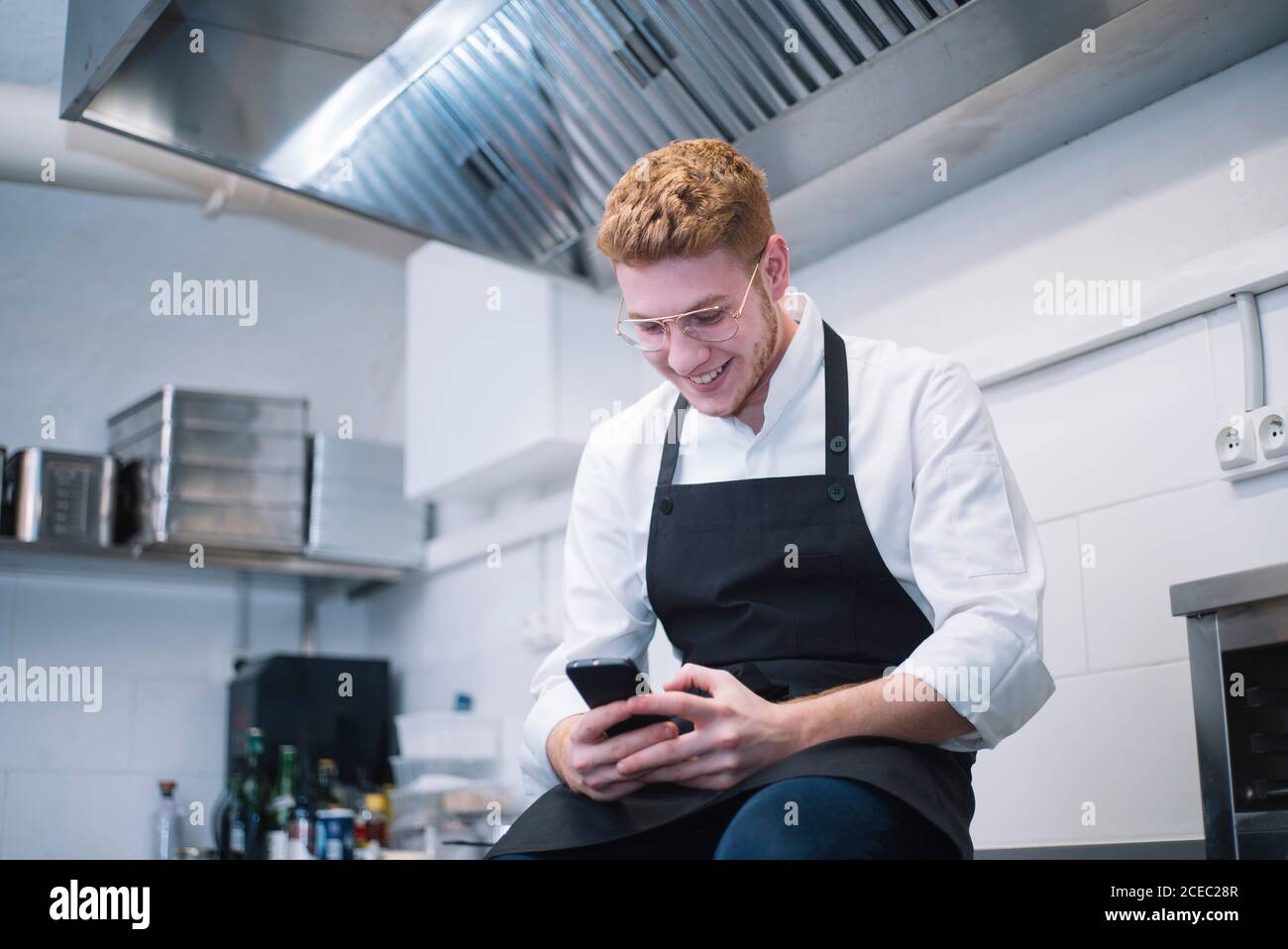 Handsome man leaning on counter hi-res stock photography and images - Alamy