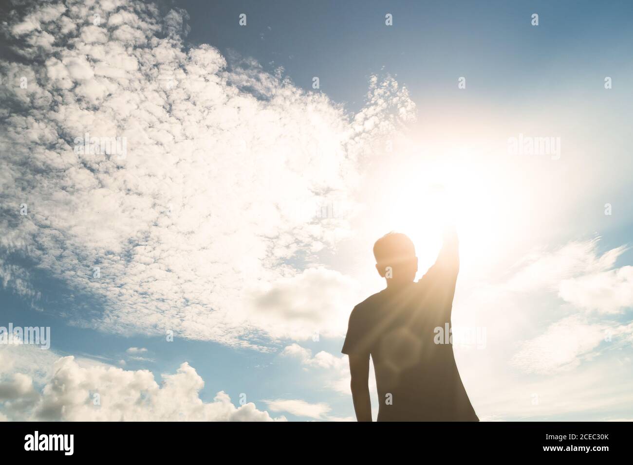 Man rise hands up to sky metaphor freedom concept with sunset sky ...