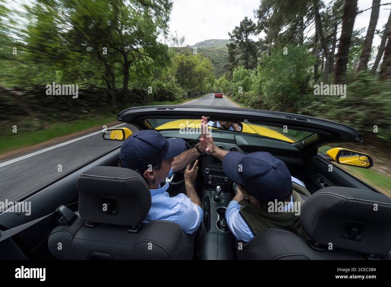 Men driving in modern car Stock Photo - Alamy