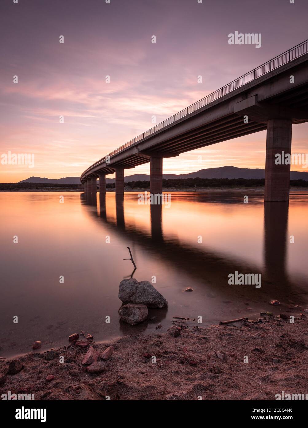 Bridge and water during sunset Stock Photo - Alamy